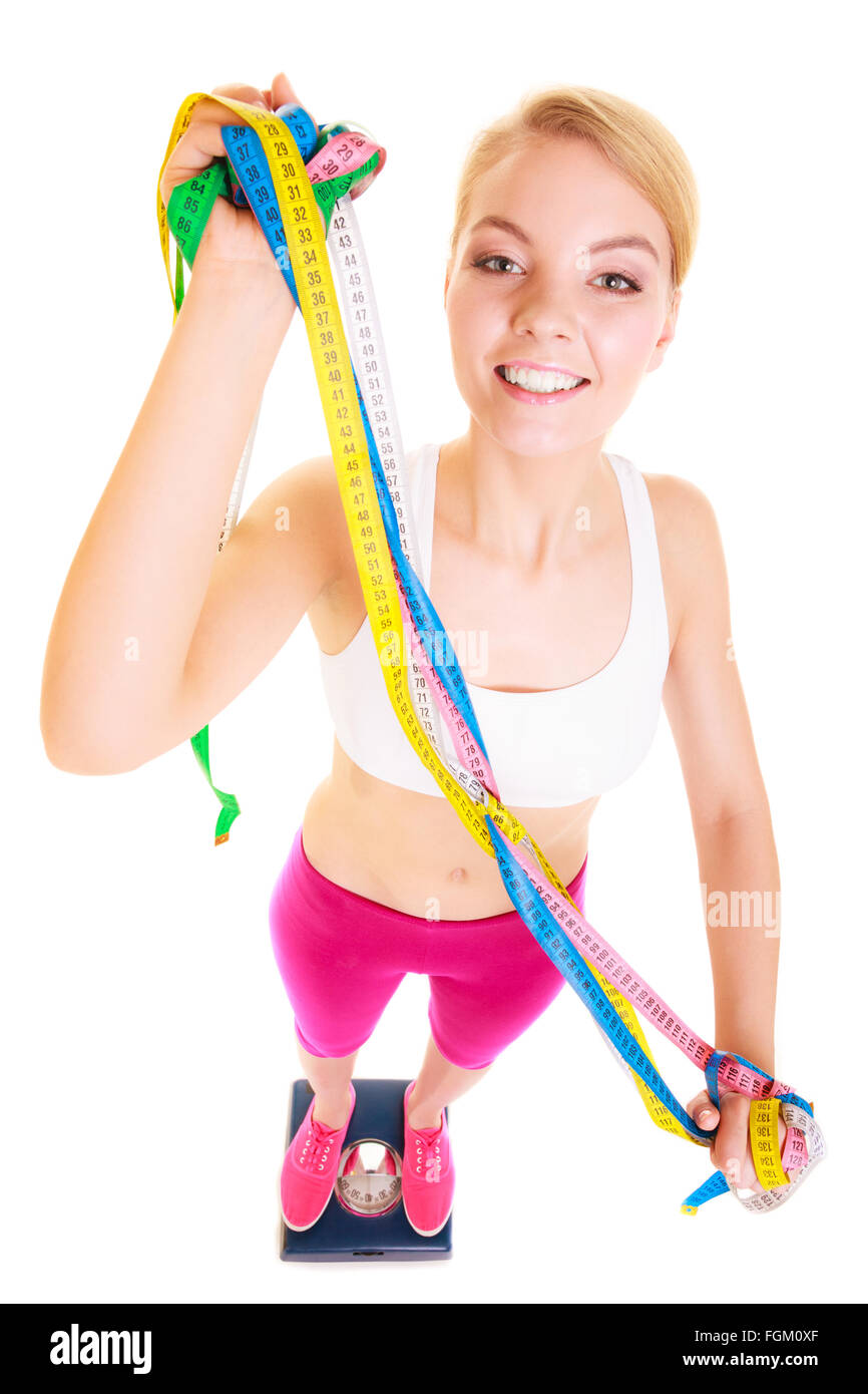 Slimming diet weight loss. Happy joyful young woman girl holding tape ...