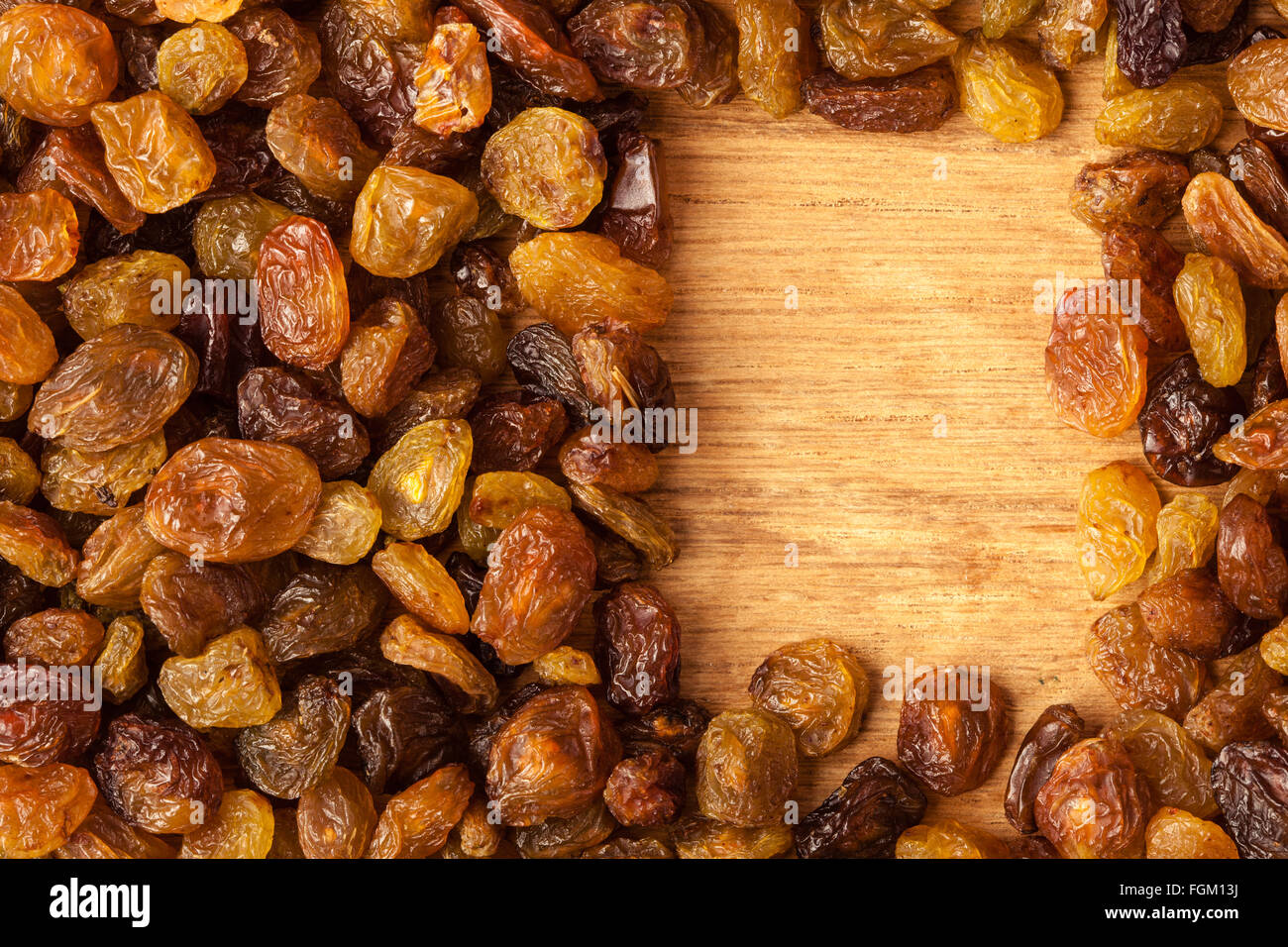 Healthy food organic nutrition. Border frame of raisin on wooden table ...