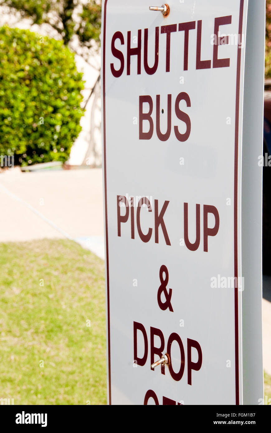 Sign for shuttle bus pick up and drop off Stock Photo - Alamy