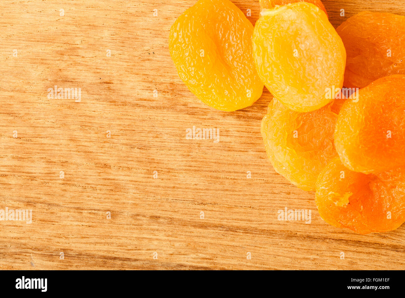 Healthy nutrition diet. Border frame of dried apricots on wooden table ...