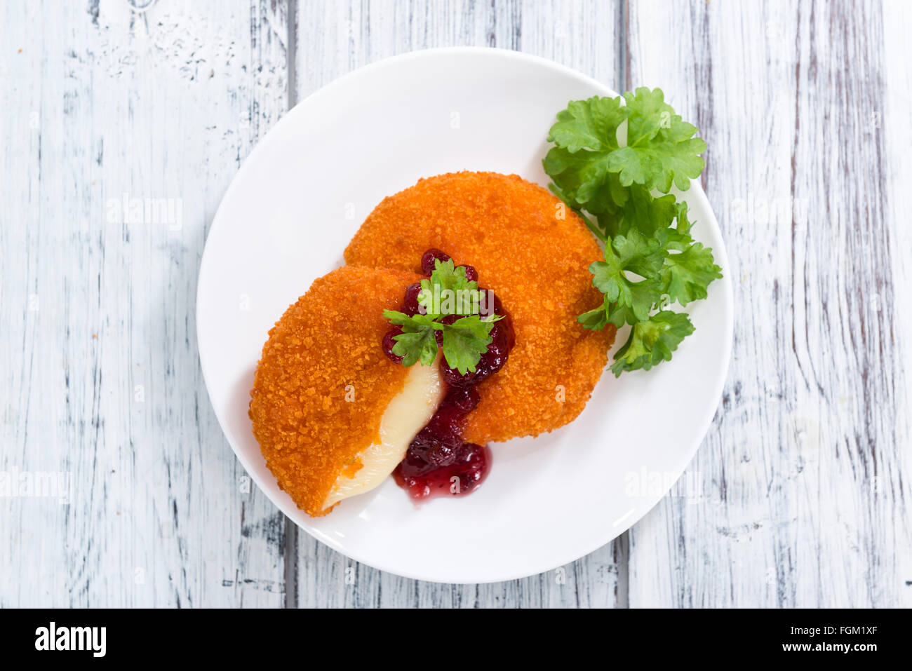 Fresh made Fried Camembert (selective focus) on wooden background Stock ...