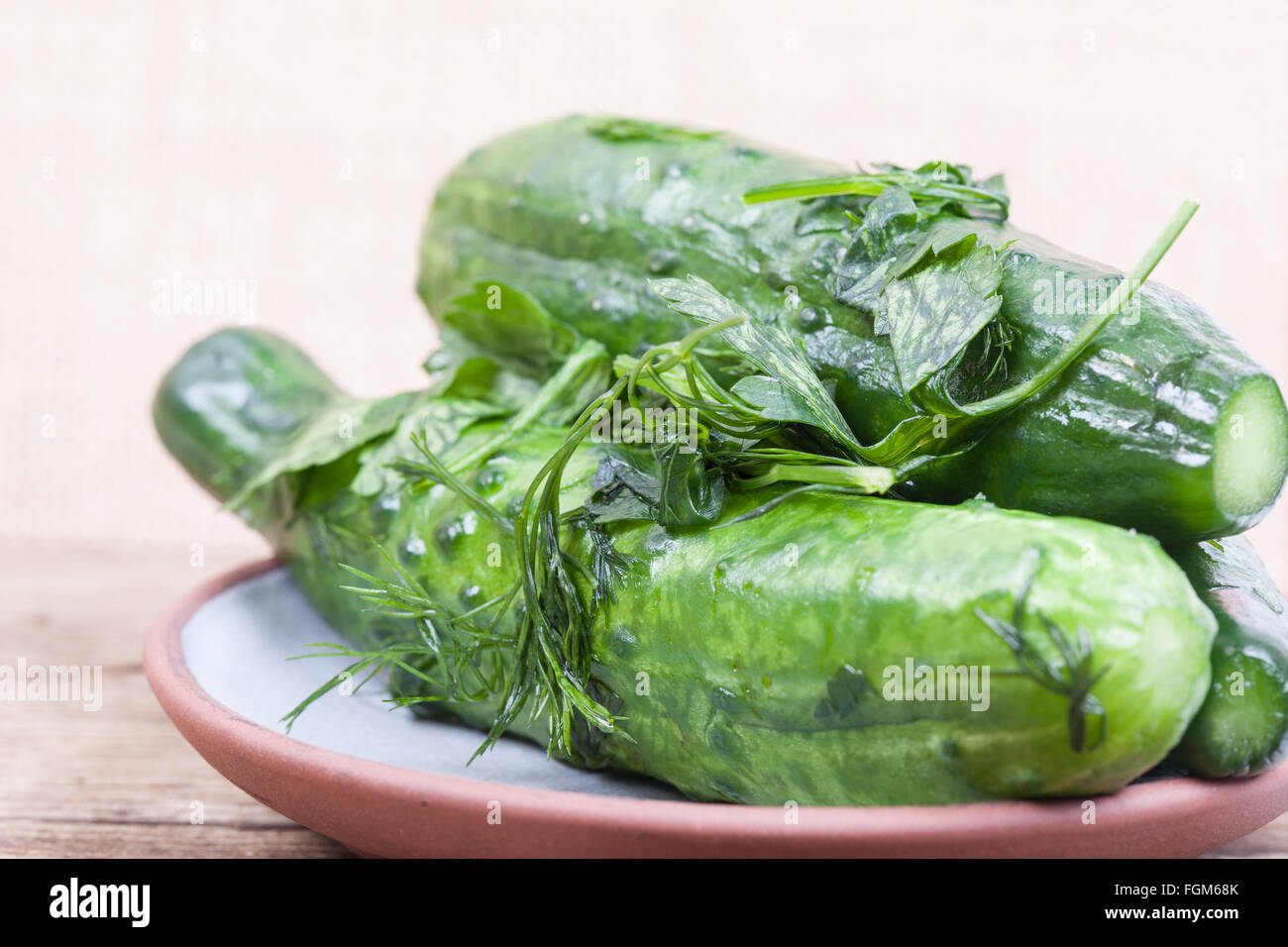 green pickles in a bowl still life background Stock Photo - Alamy