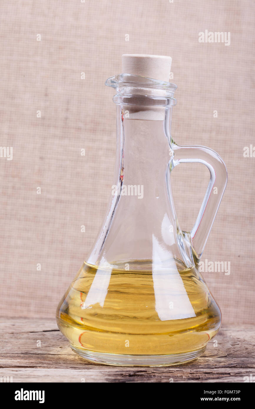 background cooking oil in bottle on wooden rustic table Stock Photo - Alamy
