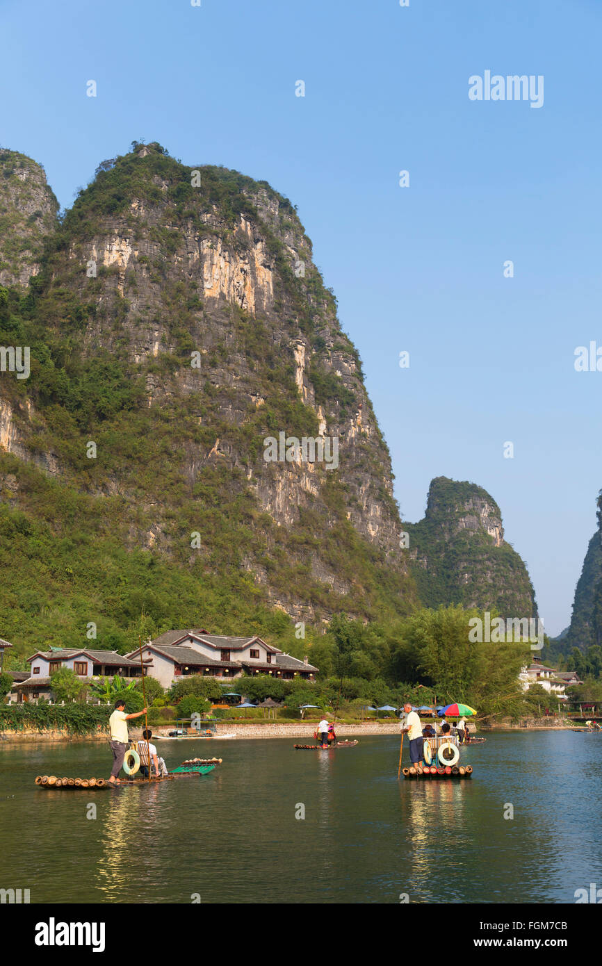 People taking bamboo raft along Yulong River, Yangshuo, Guangxi, China ...