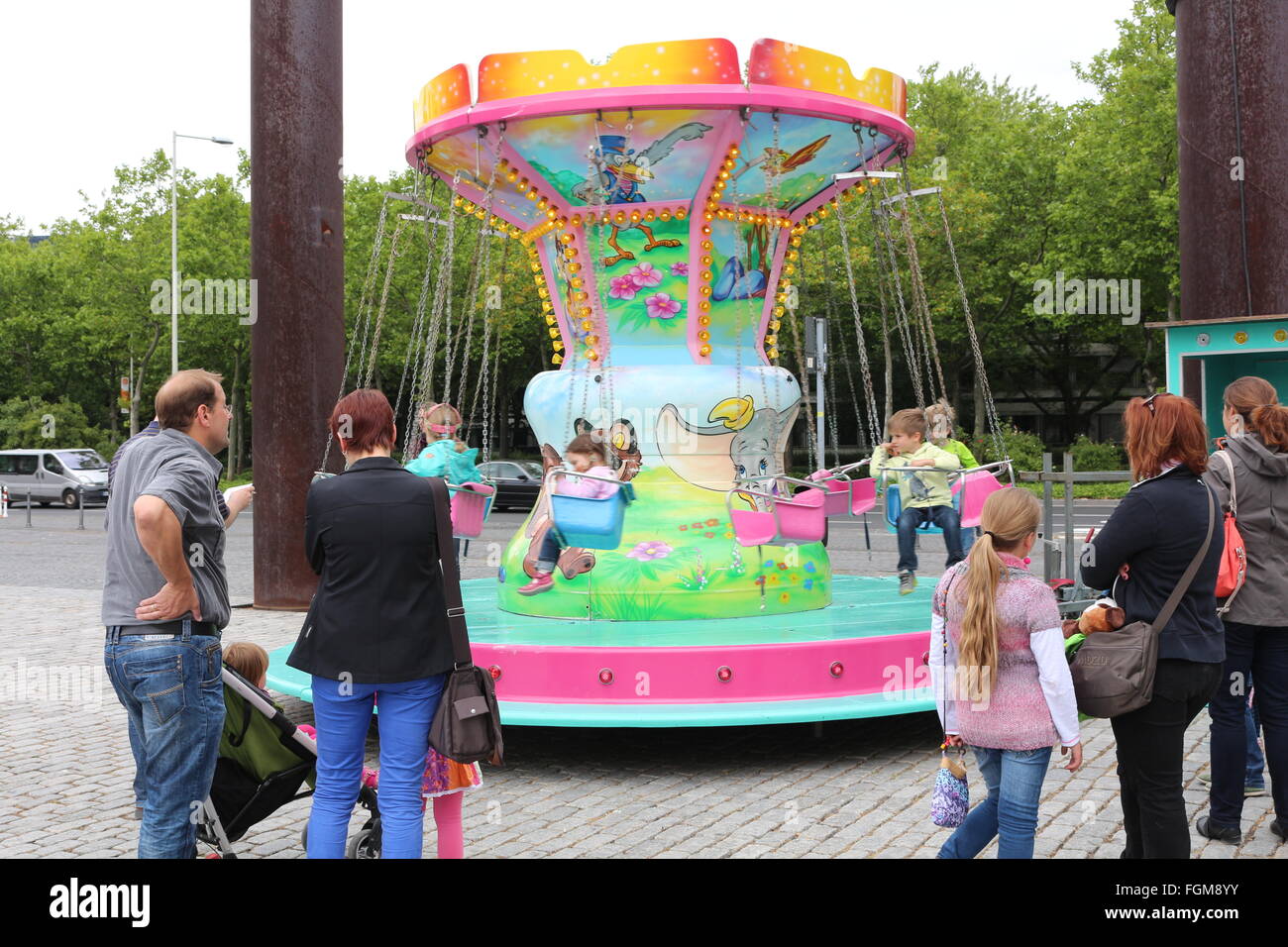 children on a merry-go-round Stock Photo - Alamy