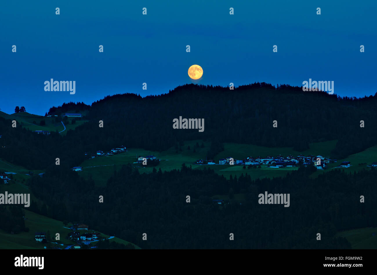 Full Moon rising in the Alps Stock Photo - Alamy