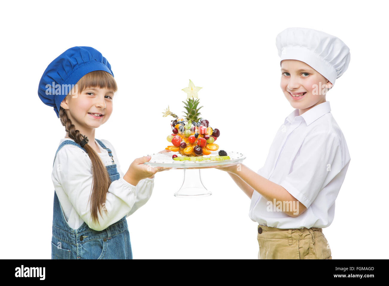 Children holding tree shape fruit snack Stock Photo - Alamy