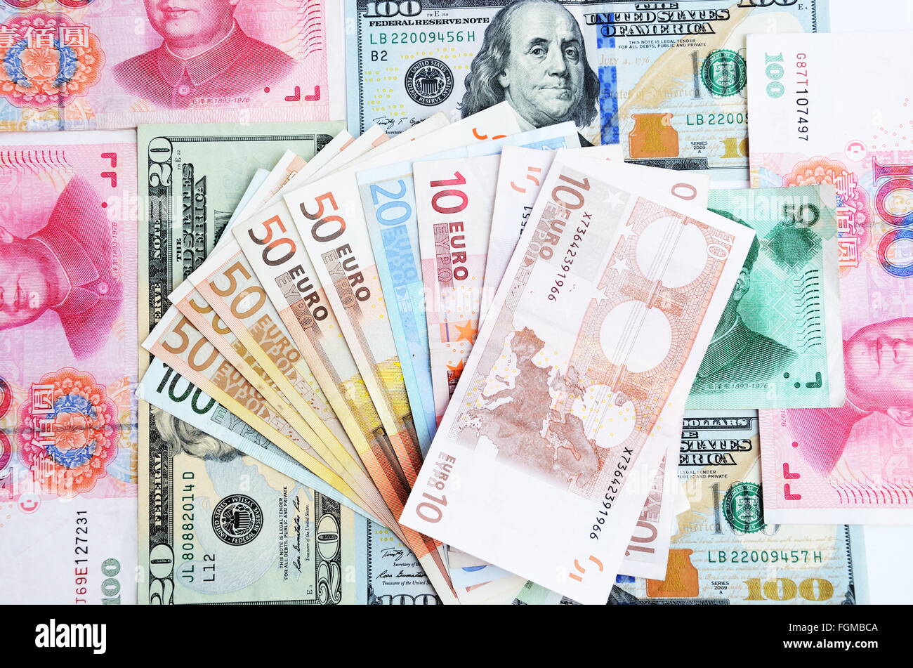 Mixed banknotes, euros, dollars and Chinese yuans. Colorful background ...