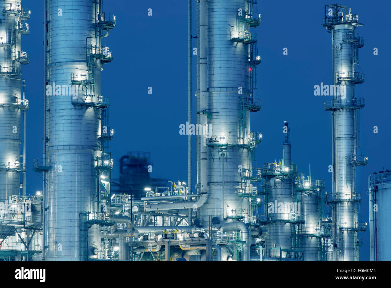 Oil refinery at night Stock Photo - Alamy