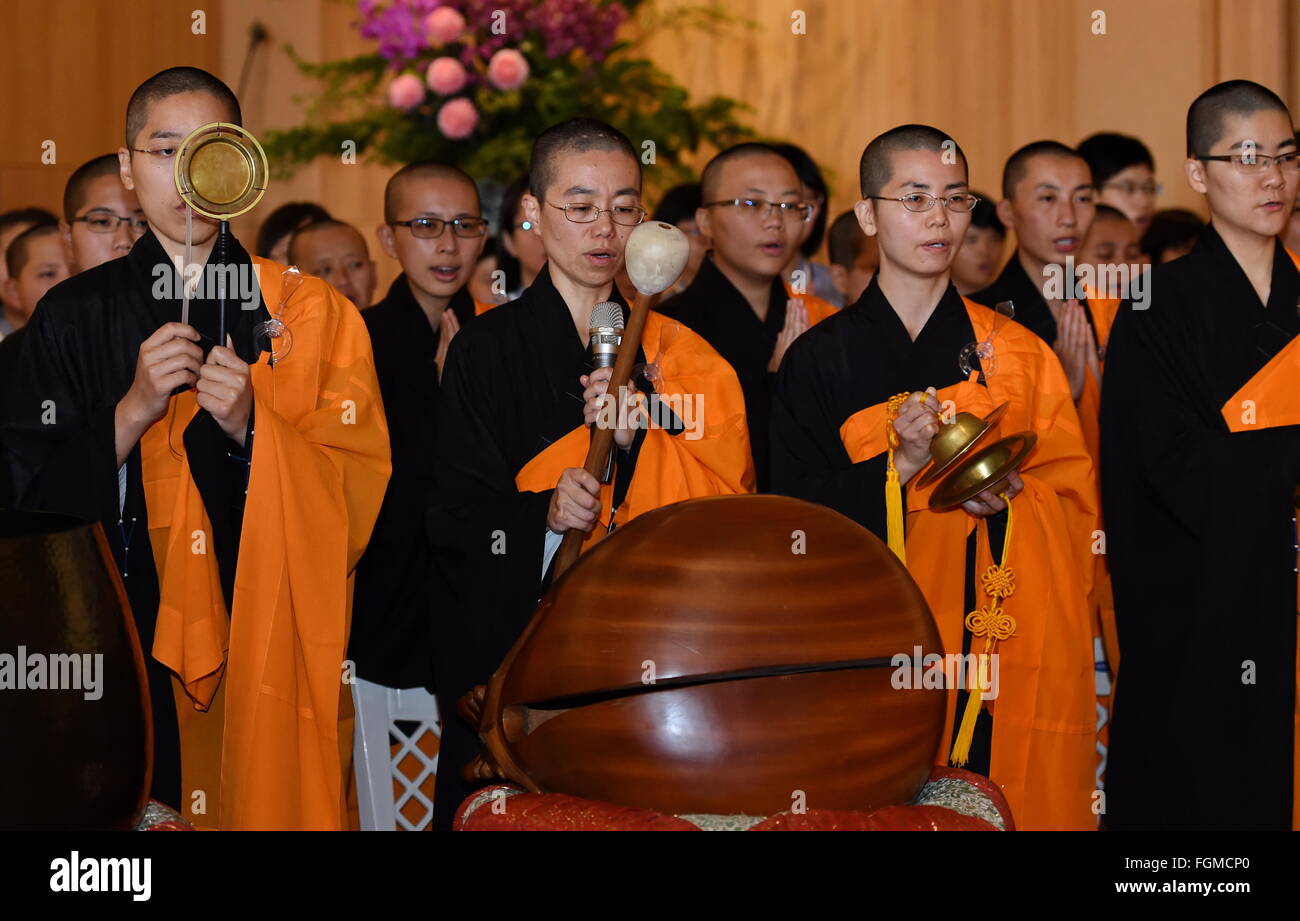 Kaohsiung, China's Taiwan. 21st Feb, 2016. Monks pray for blessings ...