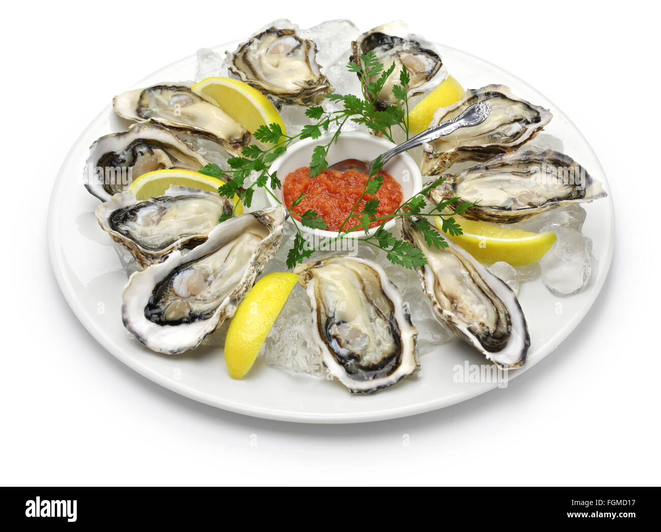 fresh oysters plate isolated on white background Stock Photo - Alamy