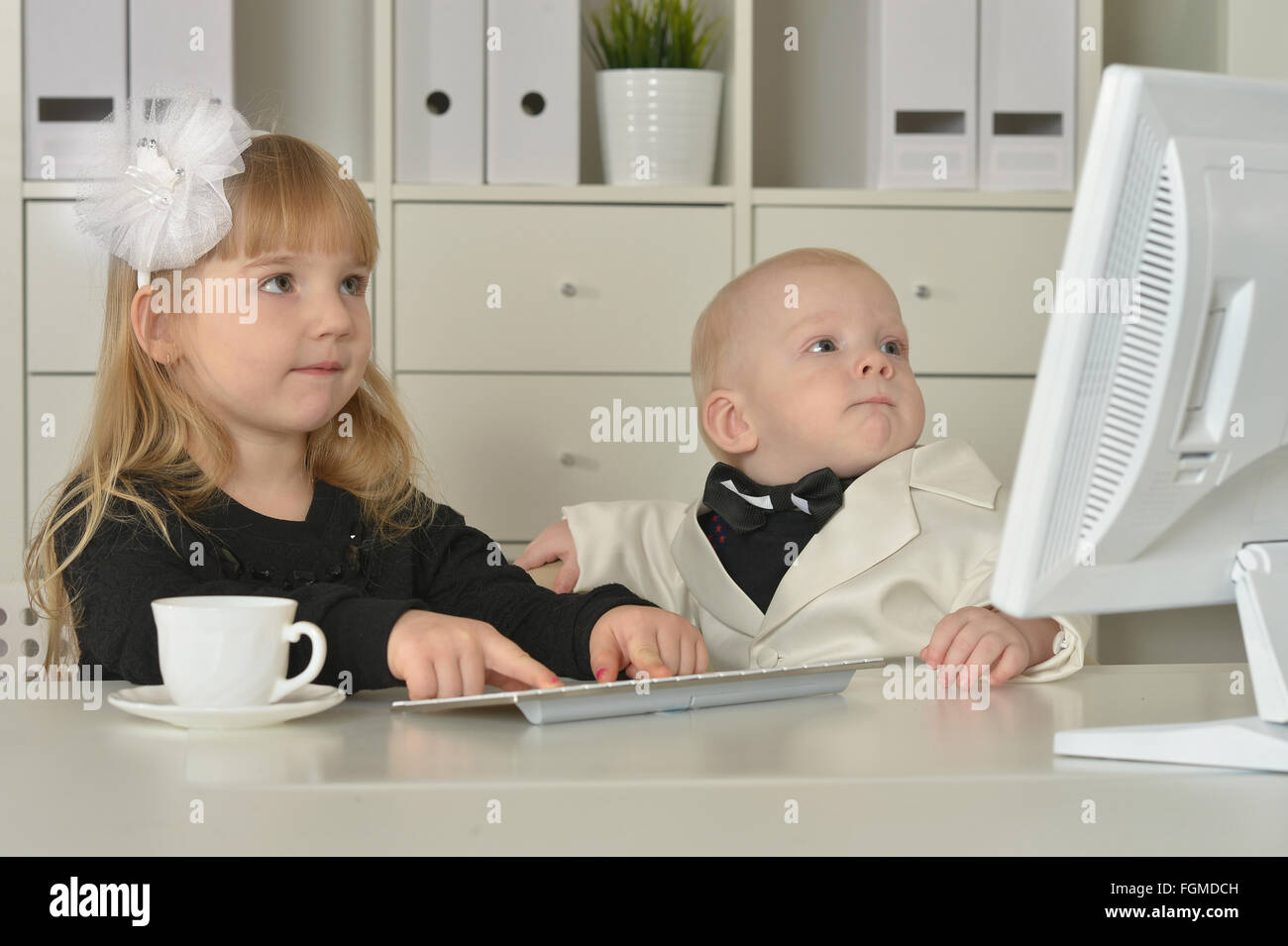 business boy with girl and computer Stock Photo - Alamy
