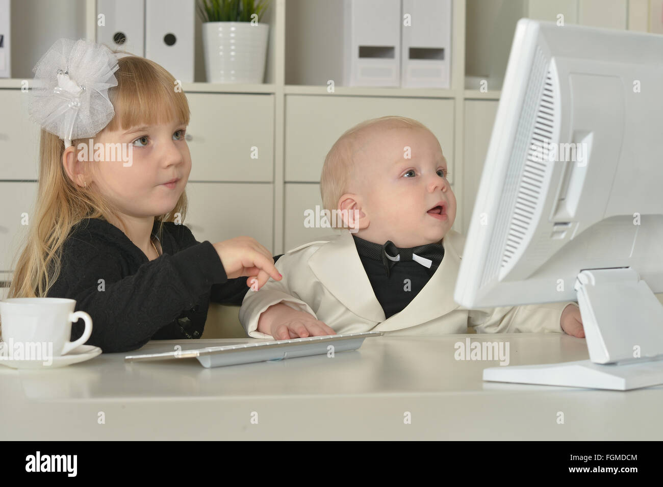 business boy with girl and computer Stock Photo - Alamy