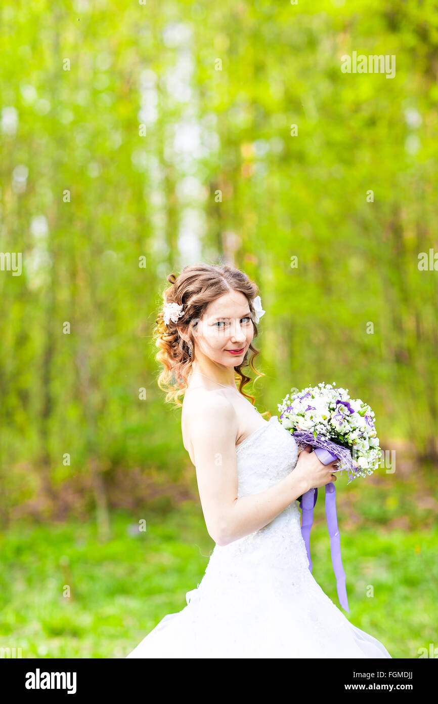 Wedding. Beautiful bride with bouquet Stock Photo - Alamy