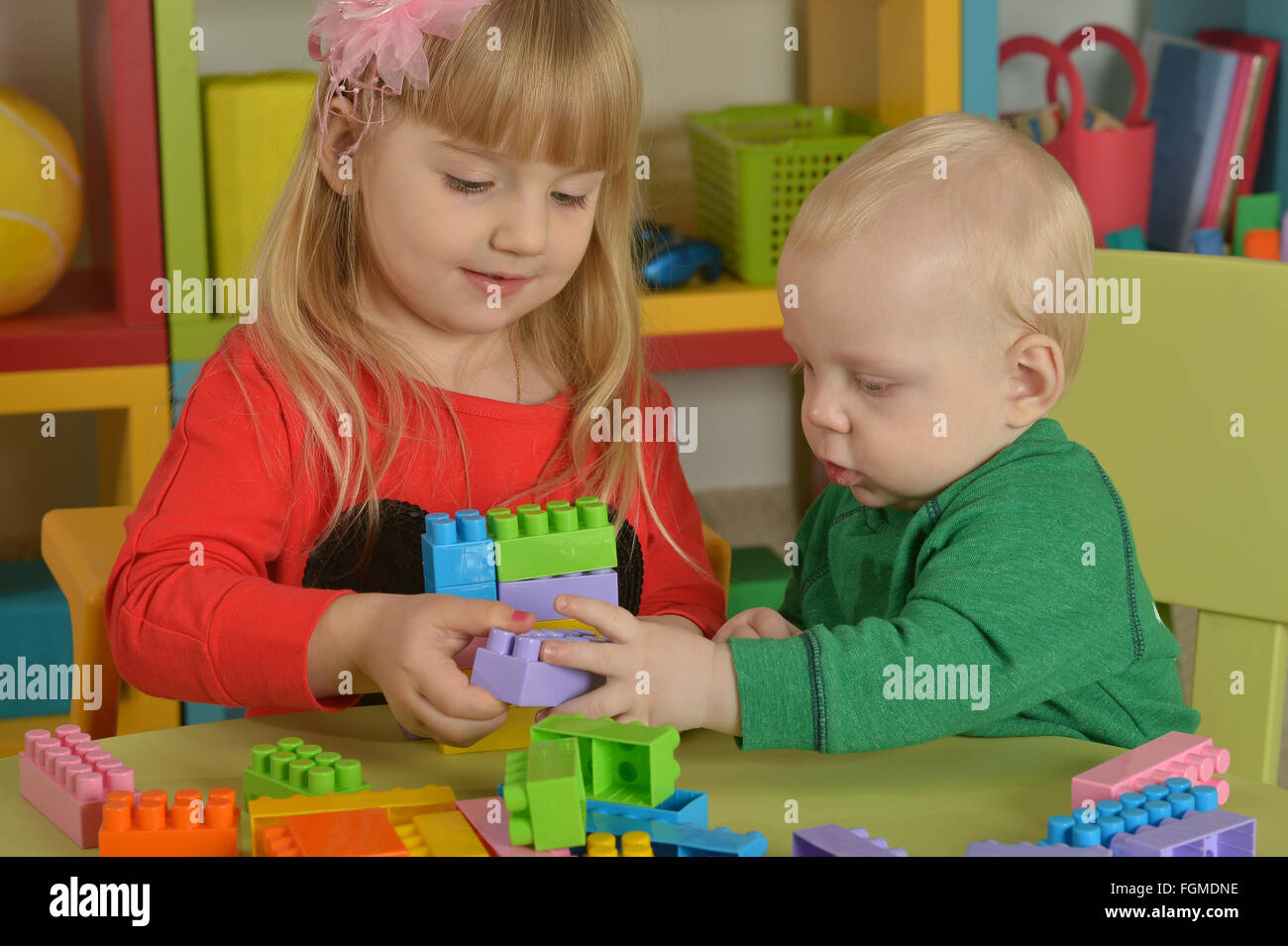 boy and girl of playing with cubes Stock Photo - Alamy