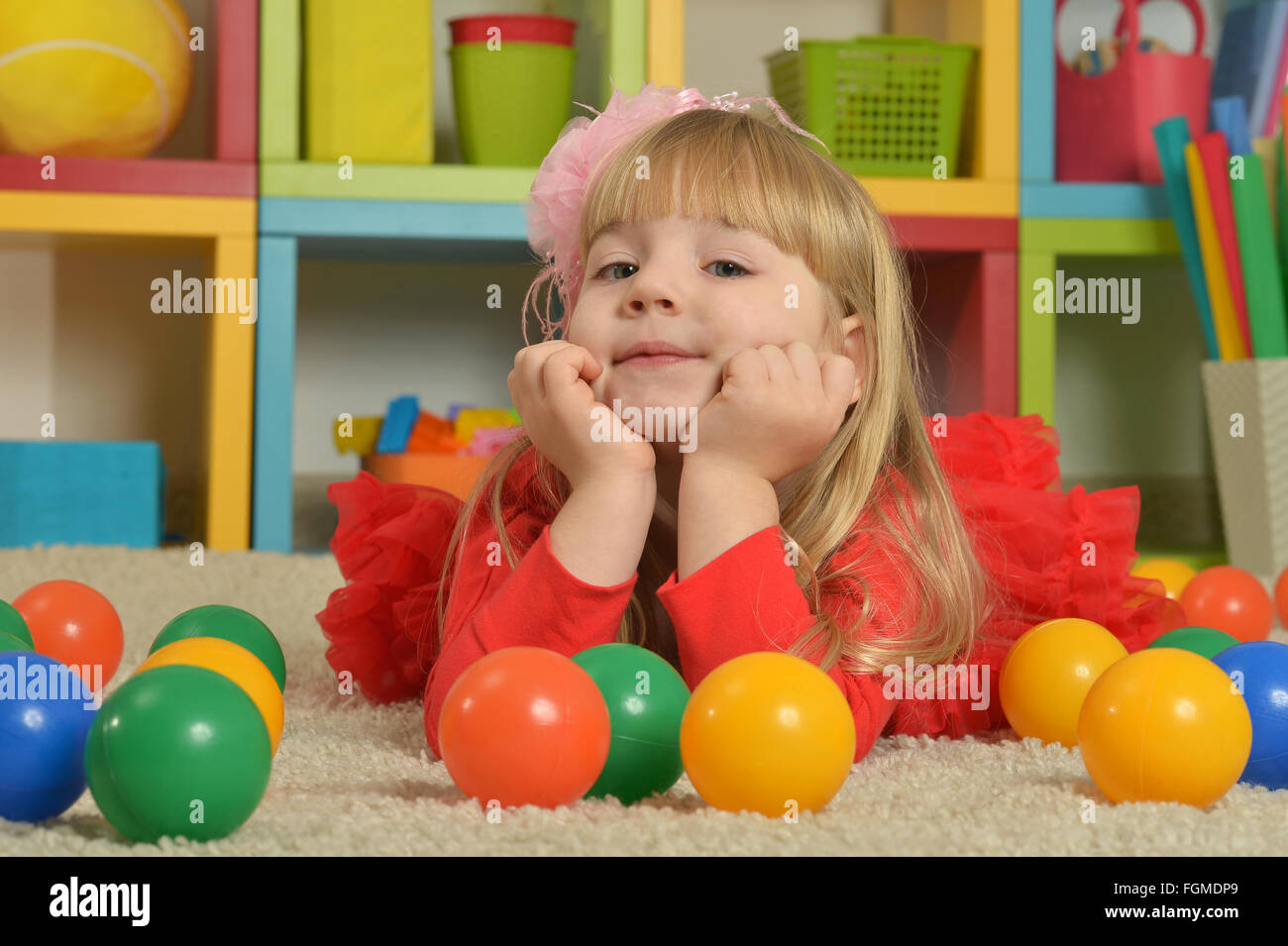 Portrait of little girl playing Stock Photo - Alamy