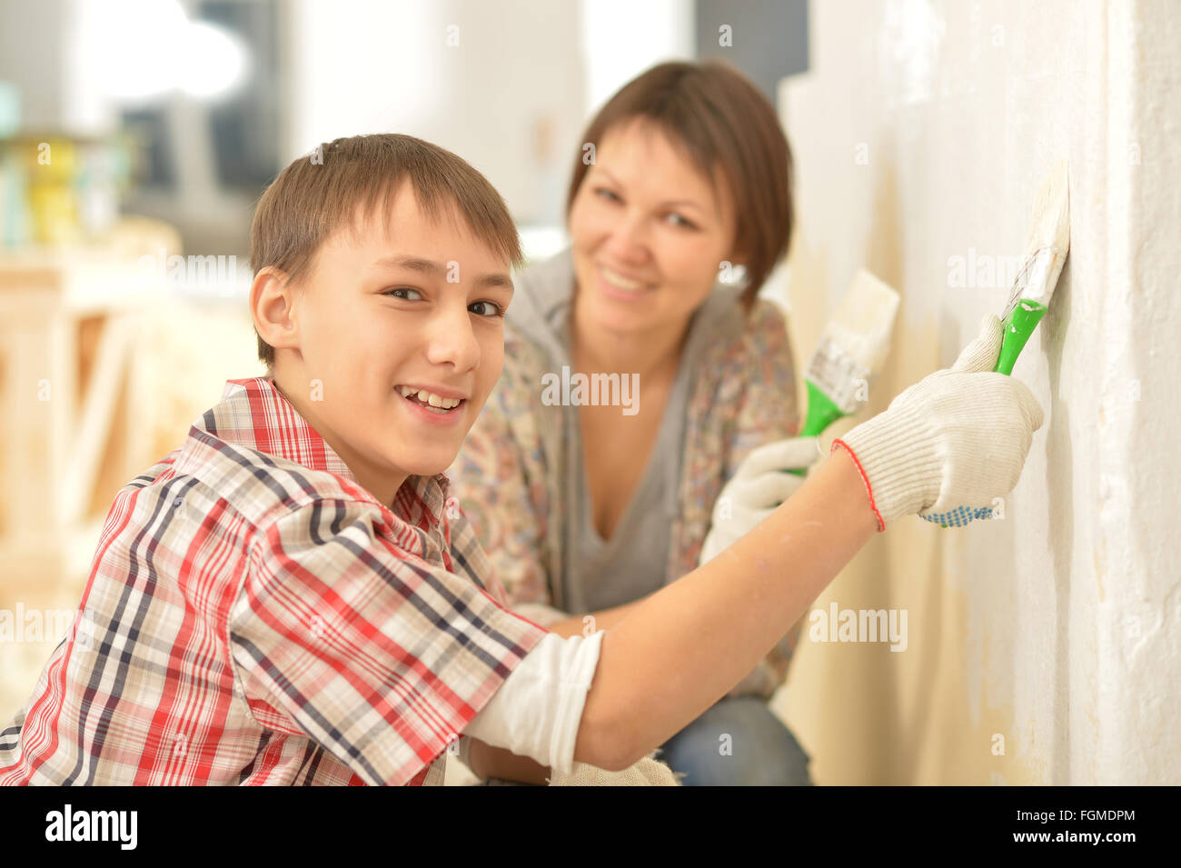 happy family doing repair at home Stock Photo - Alamy