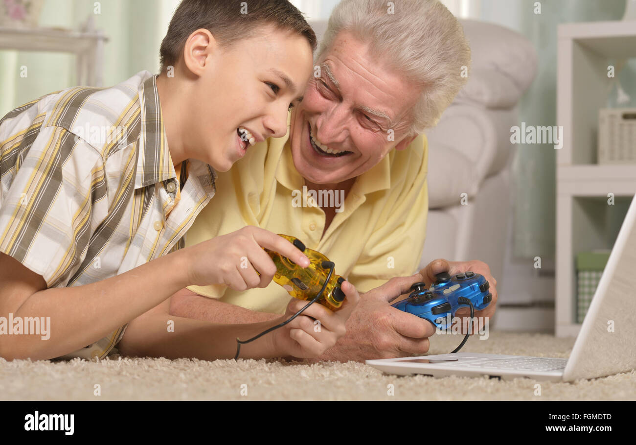 boy and grandfather playing computer game Stock Photo - Alamy boy and grandfather playing computer game Stock Photo - Alamy