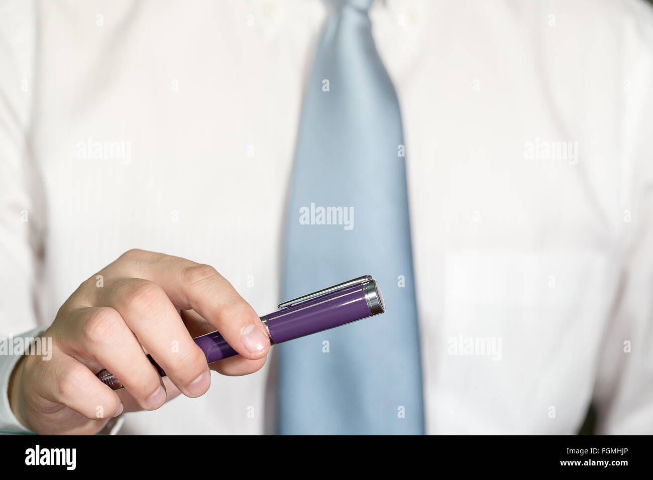 Businessman makes a note in notebook Stock Photo - Alamy