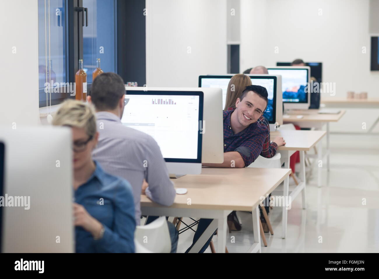 startup business, software developer working on desktop computer at ...