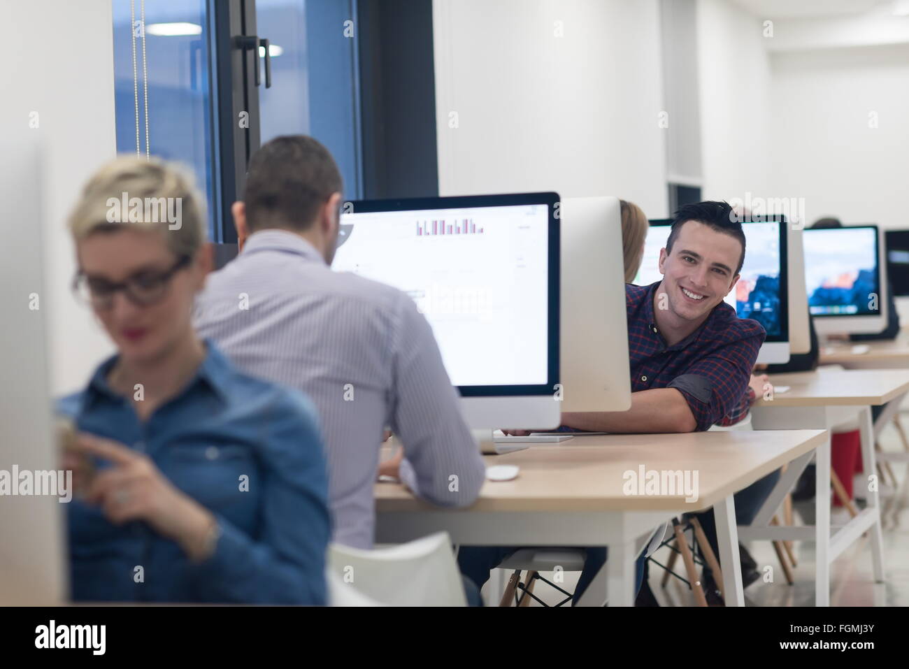 startup business, software developer working on desktop computer at ...