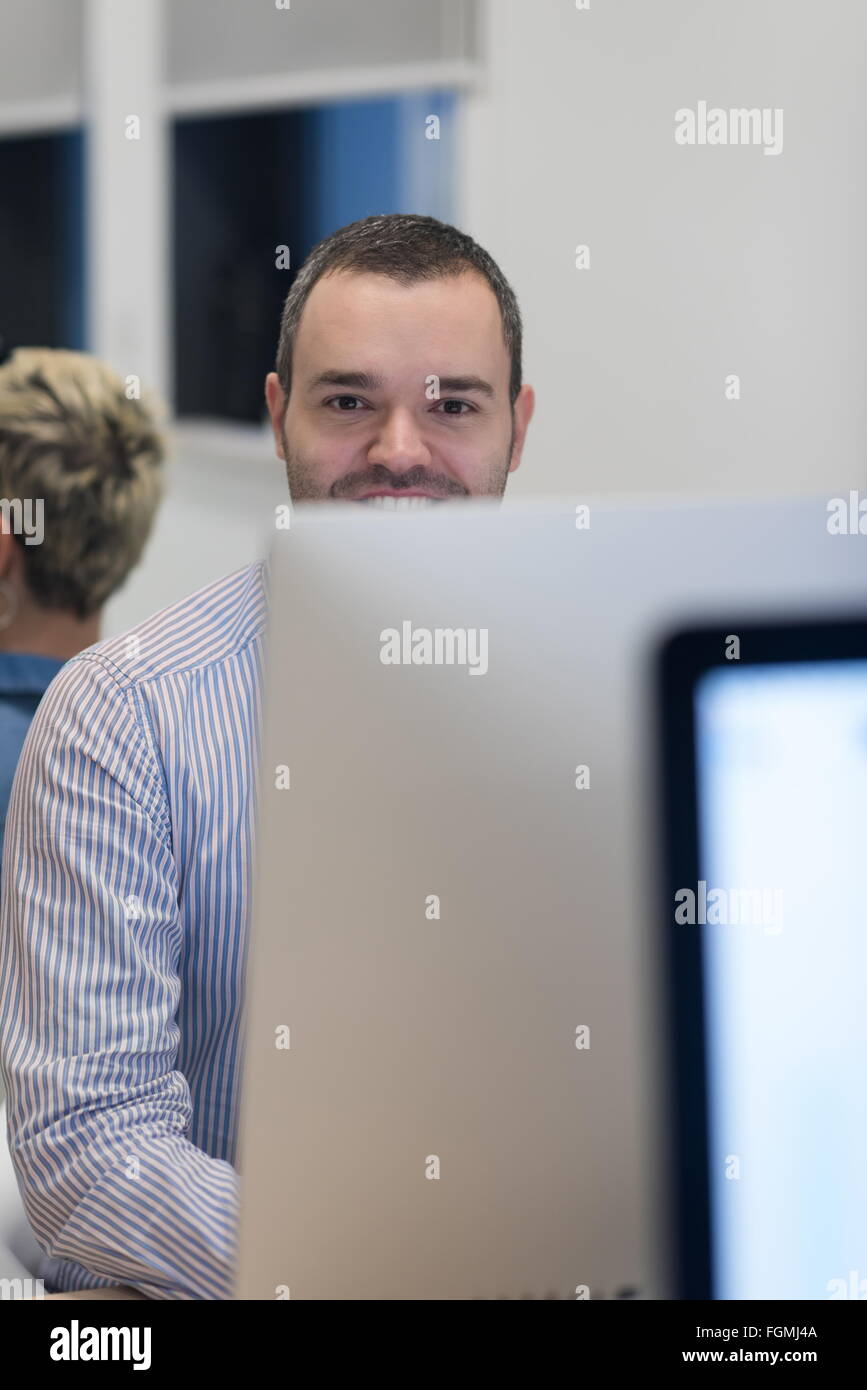 startup business, software developer working on desktop computer at ...