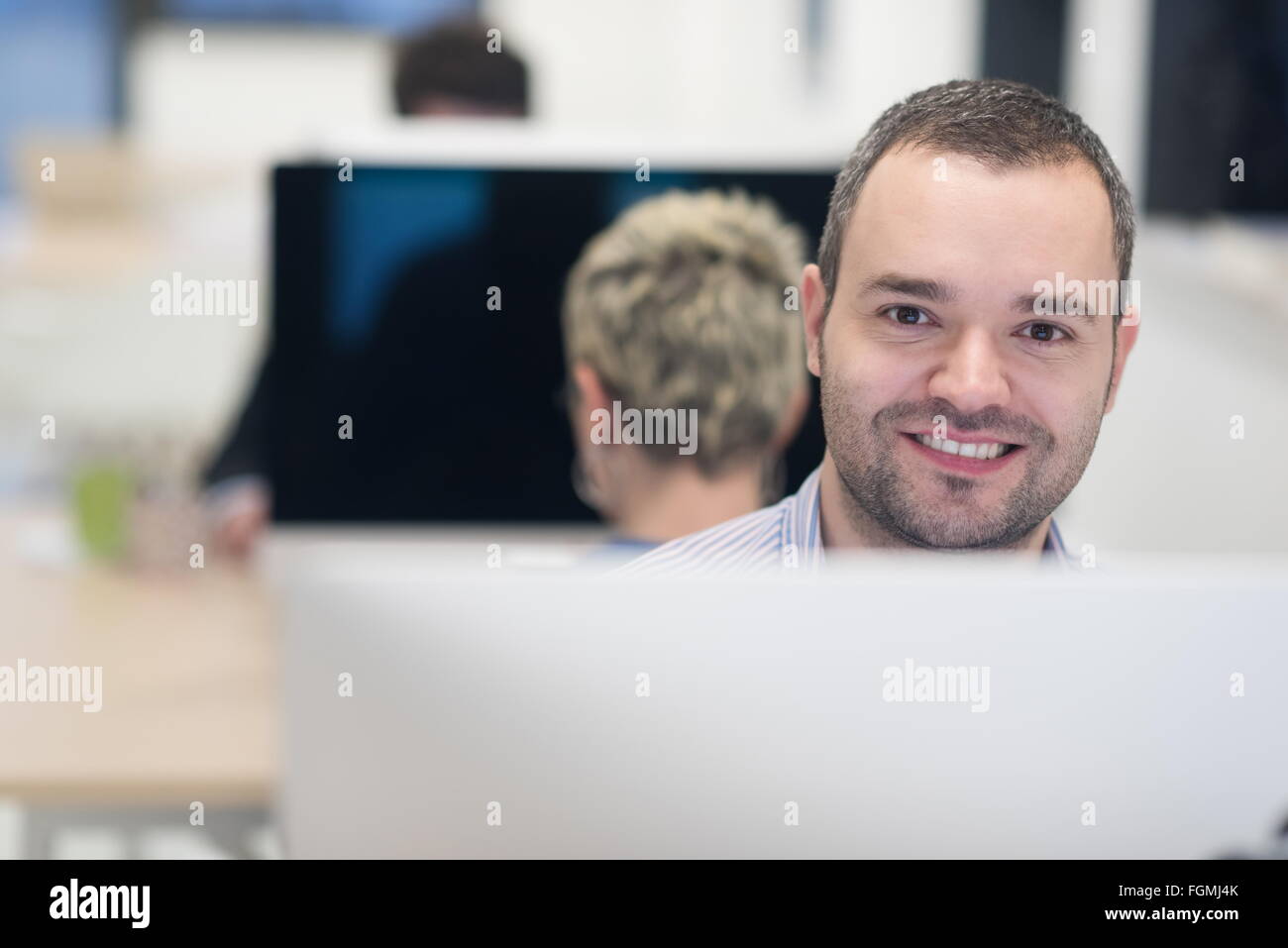 startup business, software developer working on desktop computer at ...