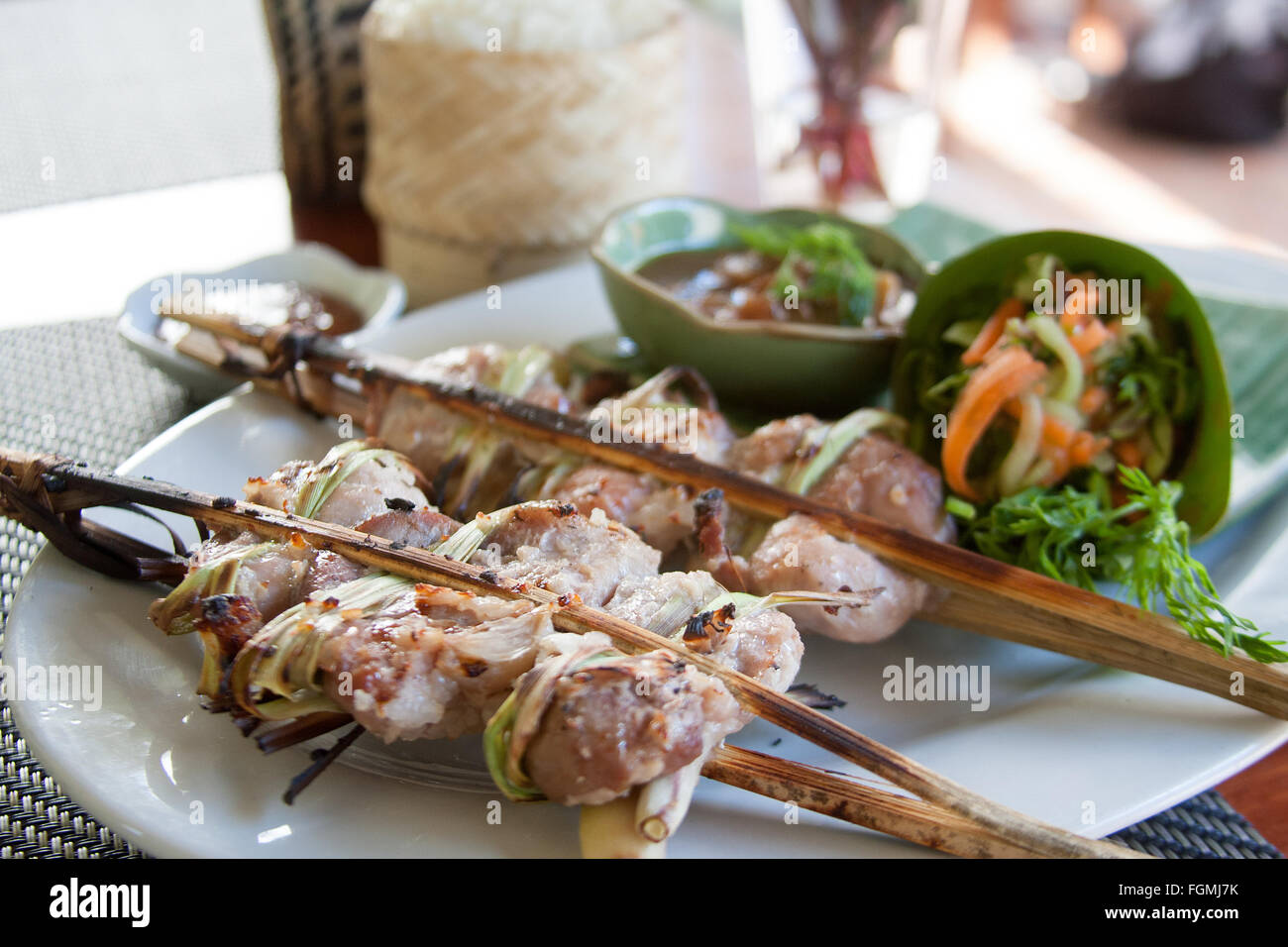 Ping Gai grilled marinated chicken served with sticky rice, local dish ...