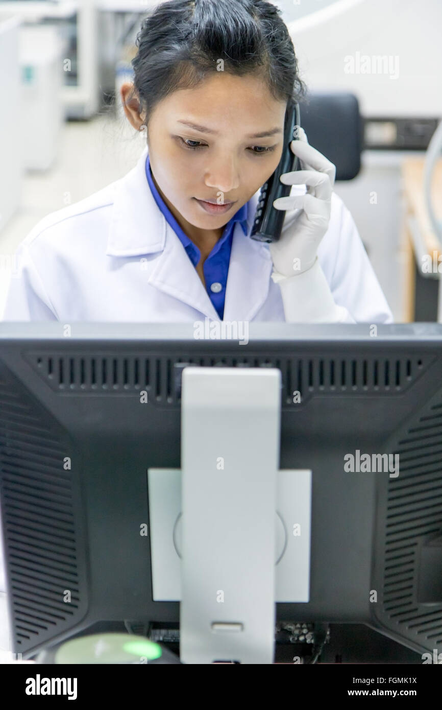 woman with phone calls in the laboratory Stock Photo - Alamy