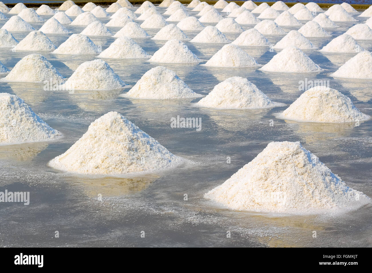 salt fields with mess of salt piled up sea salt in Thailand Stock Photo ...