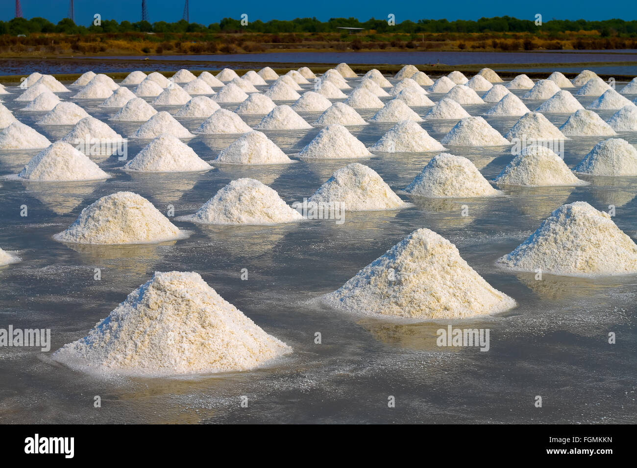 salt fields with mess of salt piled up sea salt in Thailand Stock Photo ...