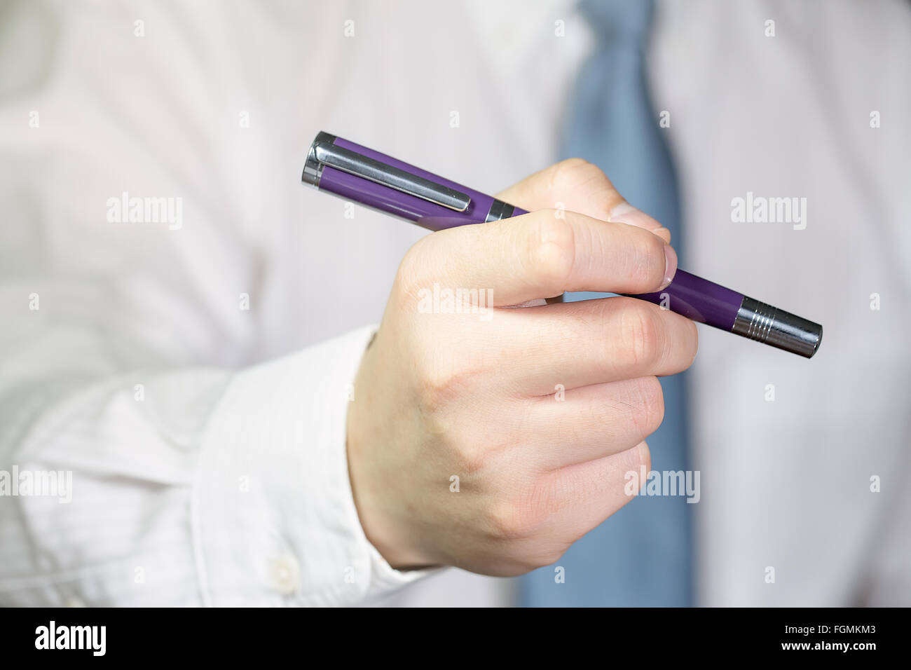 Businessman makes a note in notebook Stock Photo - Alamy