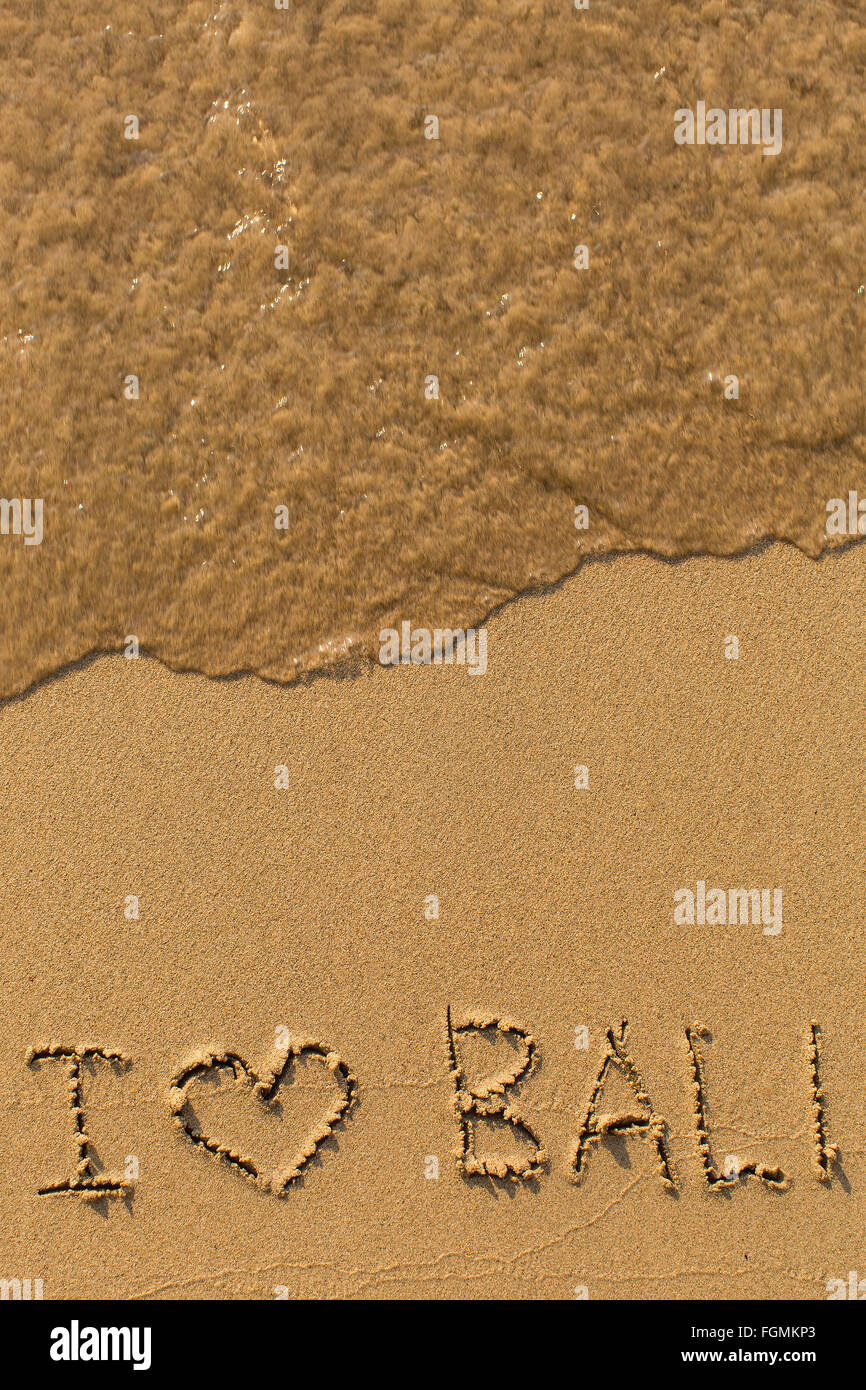 I Love Bali - text written on sandy beach with the soft wave Stock ...