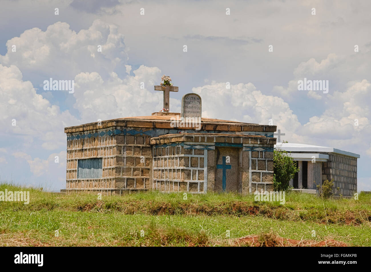 Tombs made of stones in Madagascar with dramatic cloud Stock Photo - Alamy