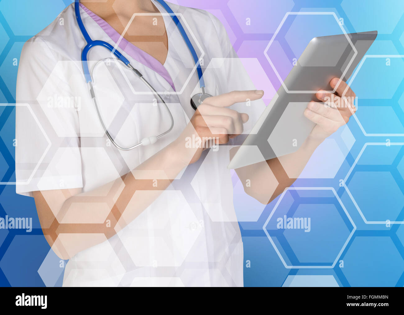 Doctor using a digital tablet on medical honecomb background Stock ...
