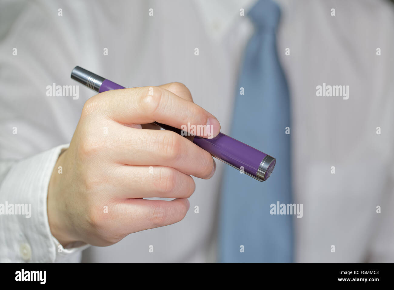 Businessman makes a note in notebook Stock Photo - Alamy