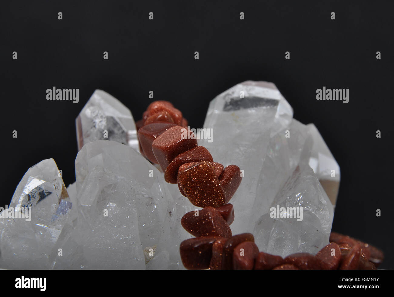 Goldstone on rock crystal Stock Photo - Alamy