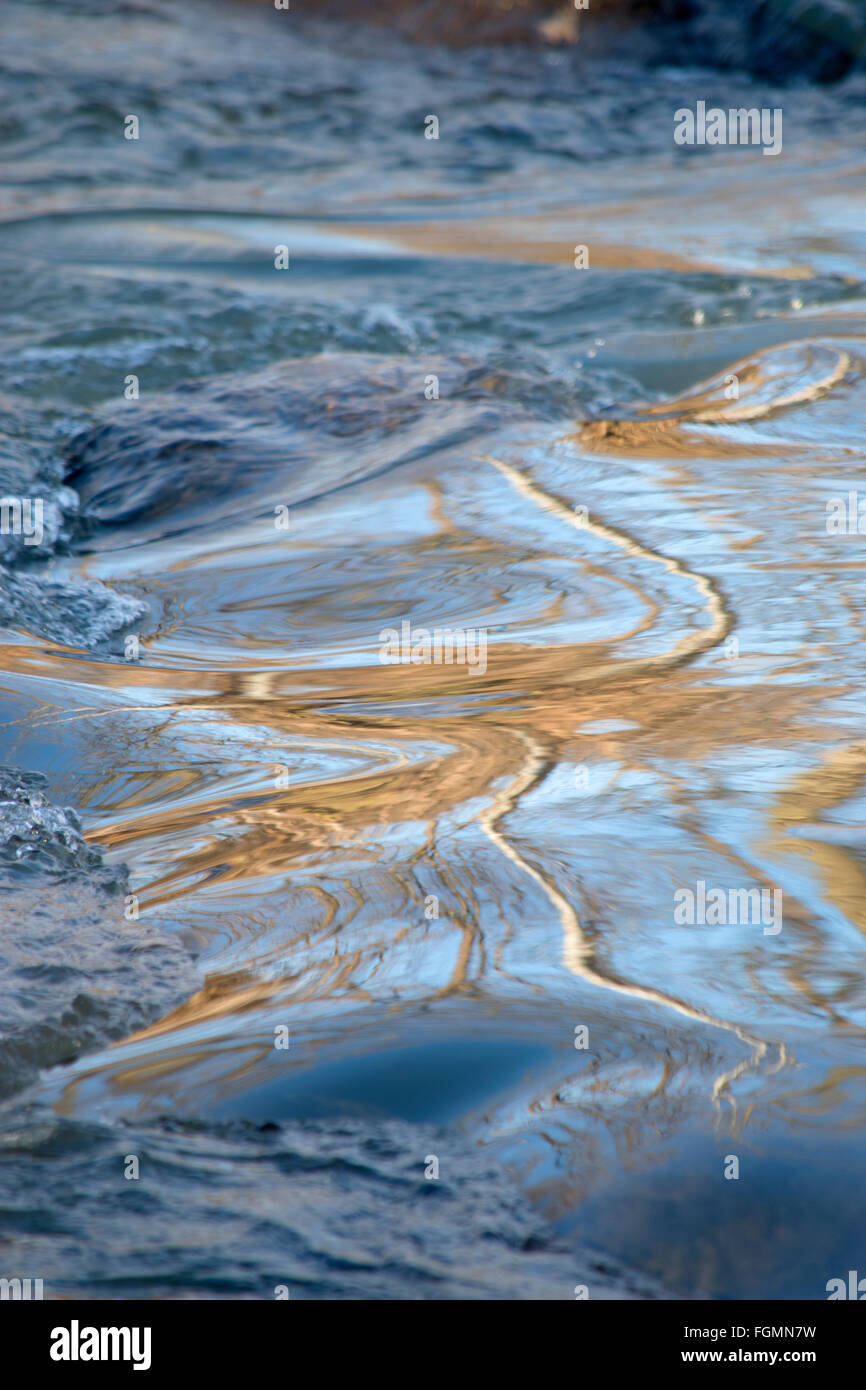 current ripples and reflection in flowing river Stock Photo - Alamy