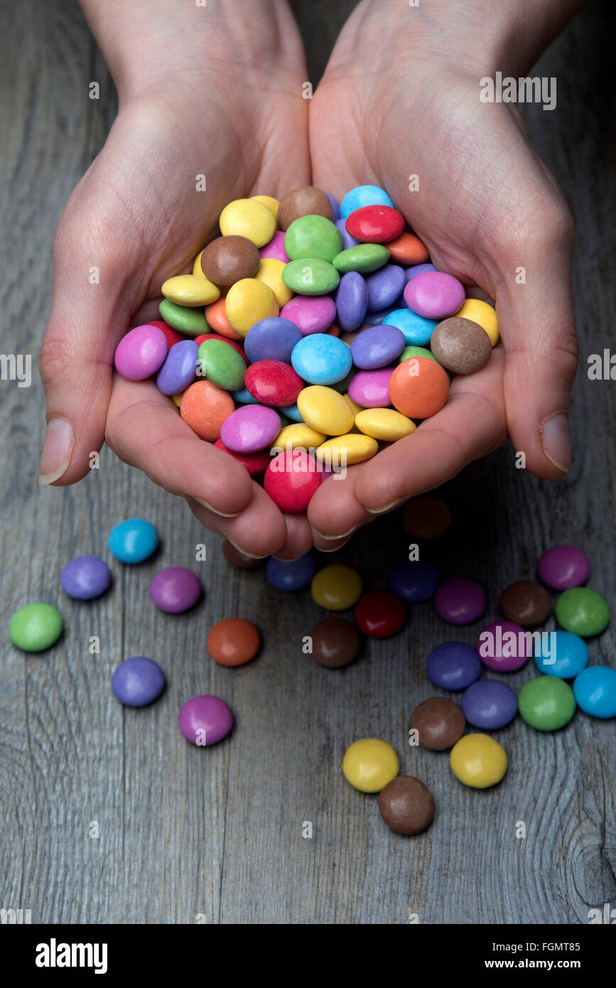 A handful of chocolate smarties Stock Photo - Alamy