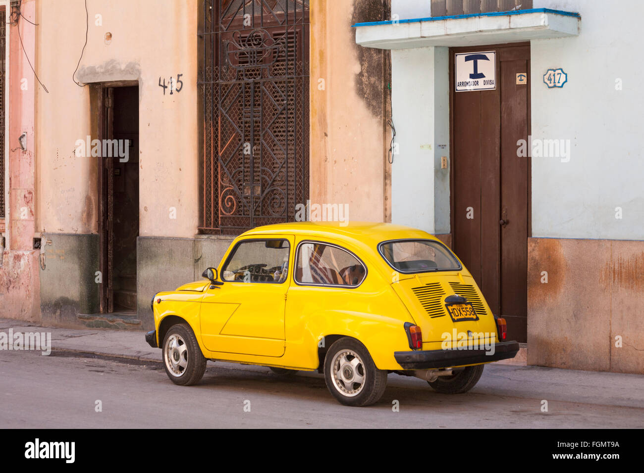 Yellow fiat car parked in road at havana cuba hi-res stock photography ...