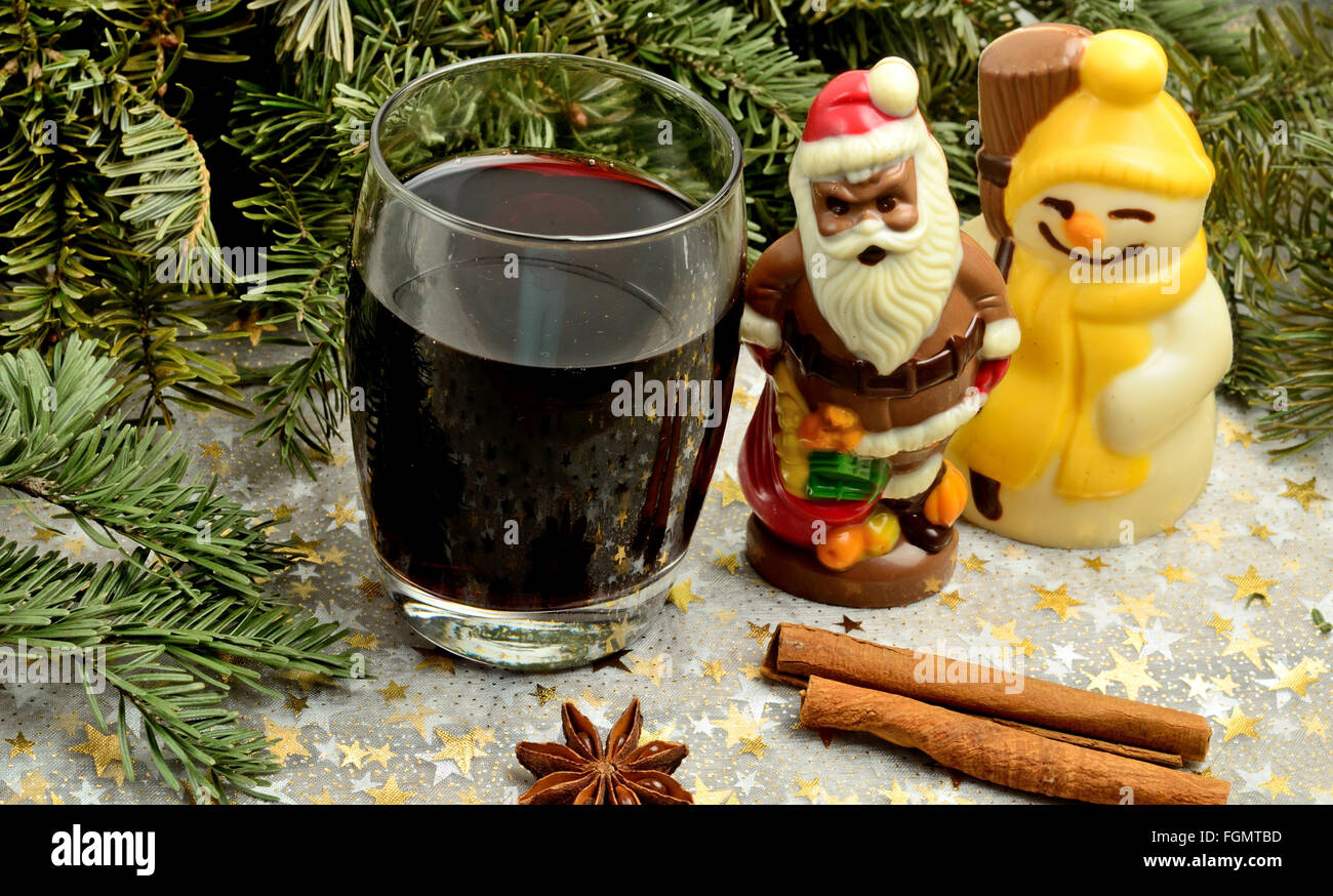 Glass with red wine and branch tree on table Stock Photo - Alamy
