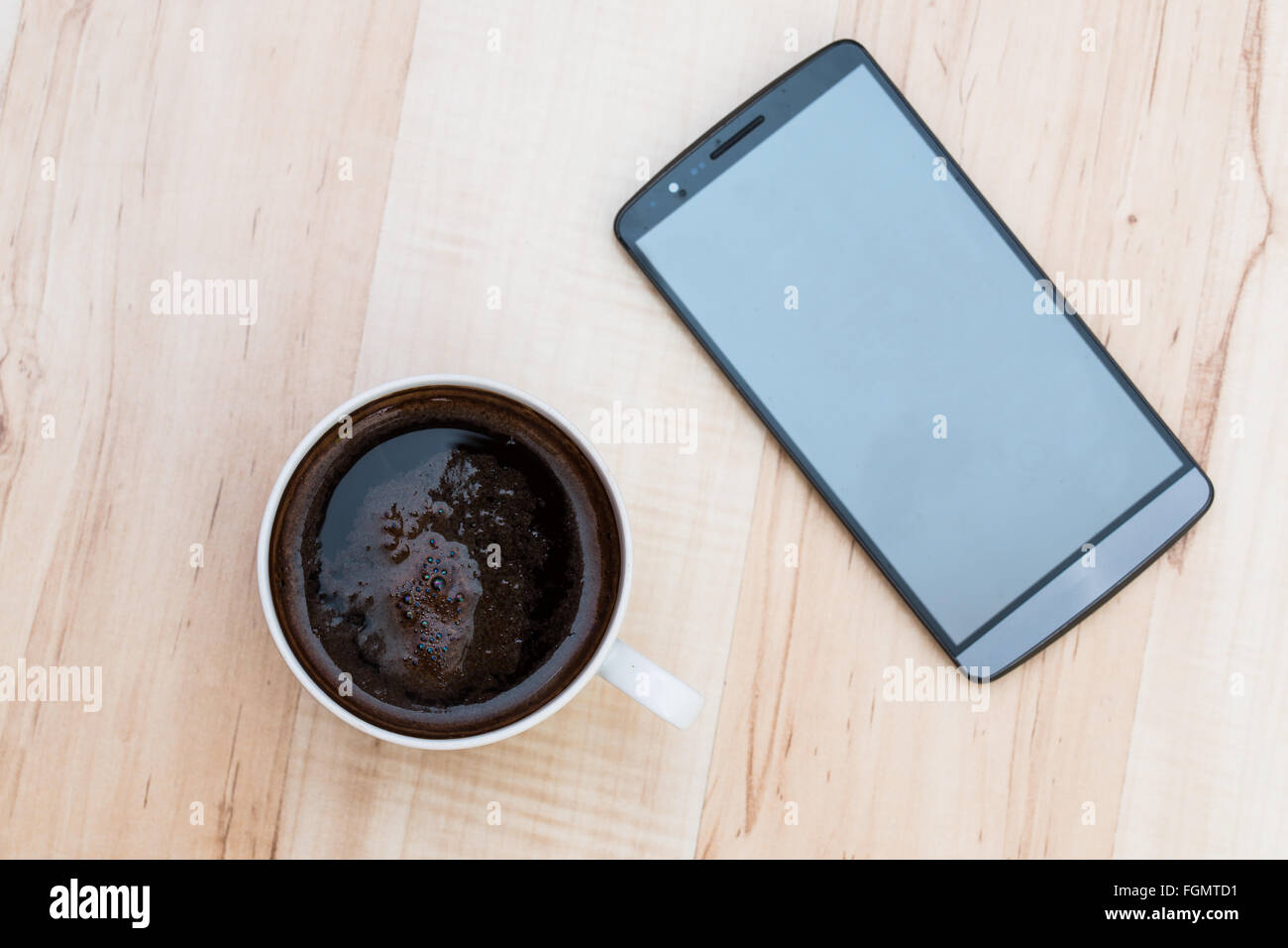 coffee and smartphone on a wooden background Stock Photo - Alamy