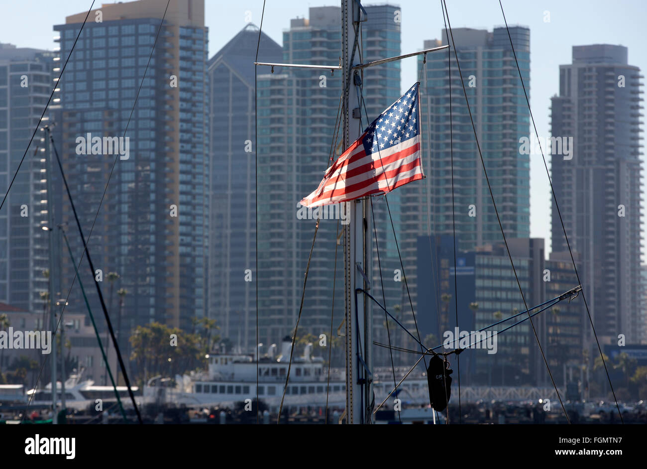 flag in sailboat rigging, San Diego skyline Stock Photo - Alamy