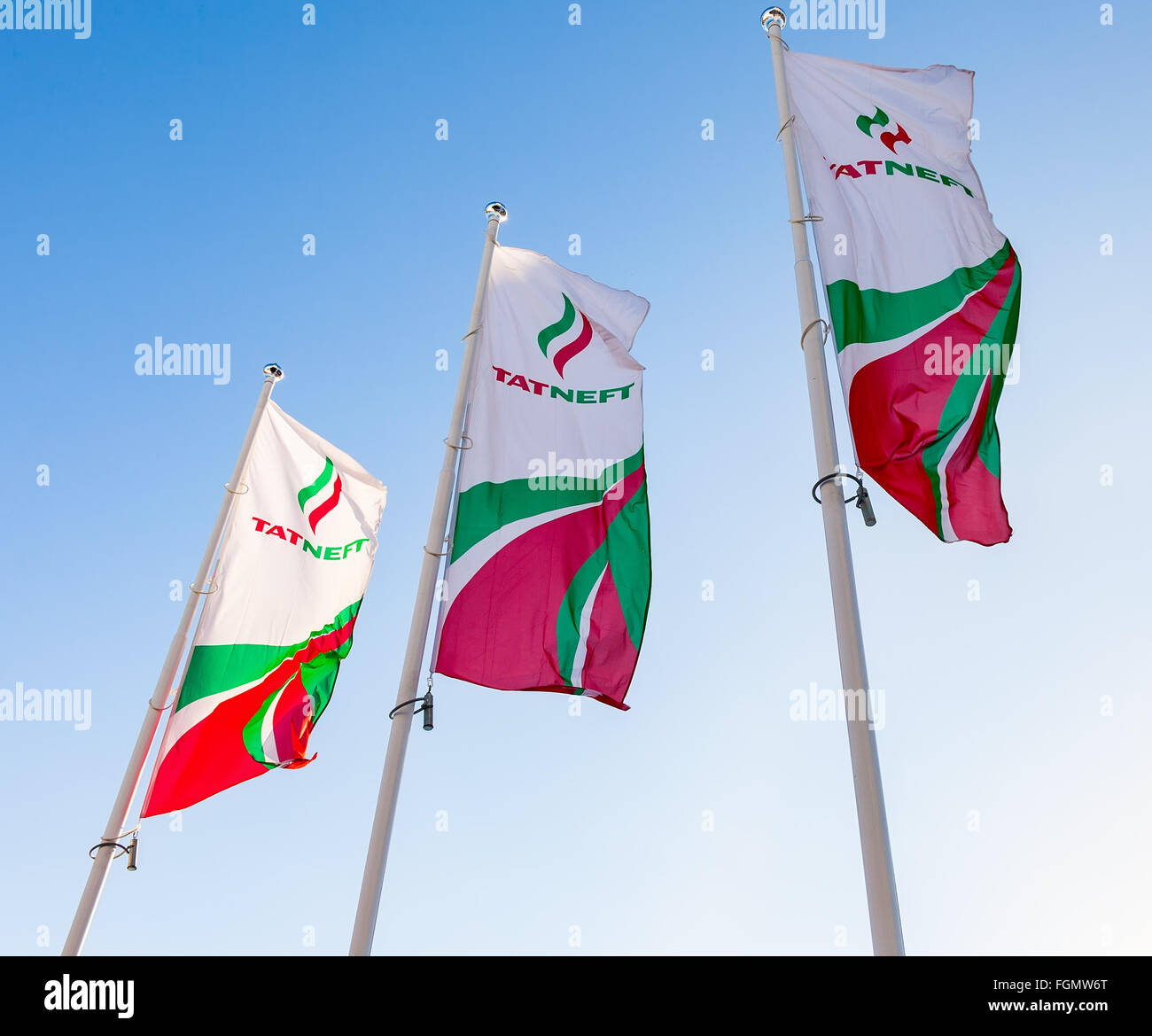 The flags of oil company Tatneft against blue sky Stock Photo - Alamy