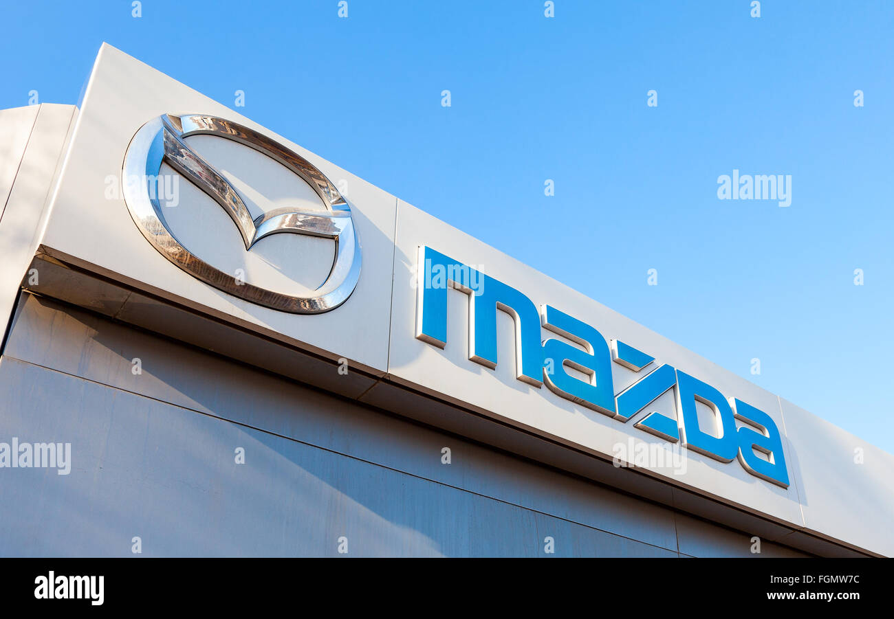Official dealership sign of Mazda. Mazda Motor Corporation is a ...
