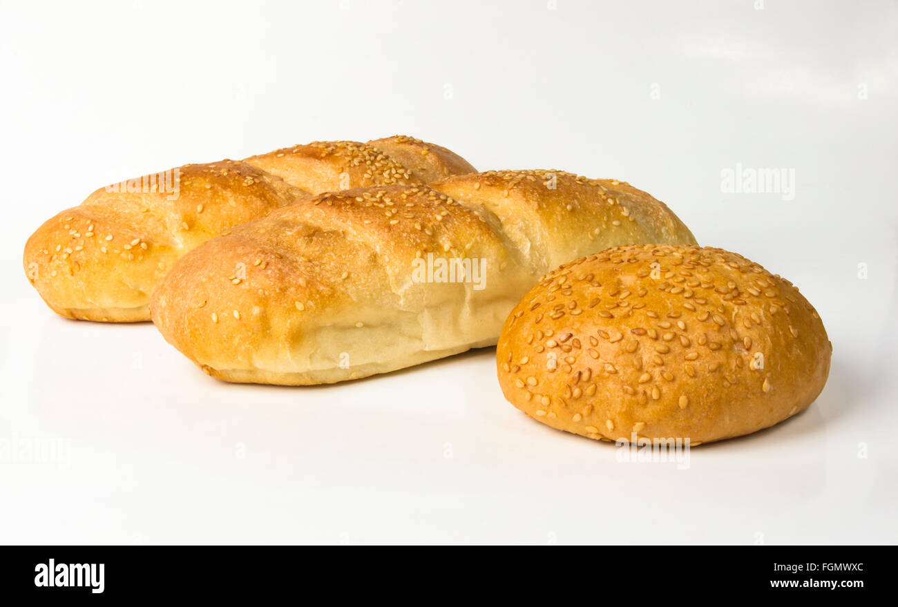 whole wheat two breads and bun on white background Stock Photo - Alamy