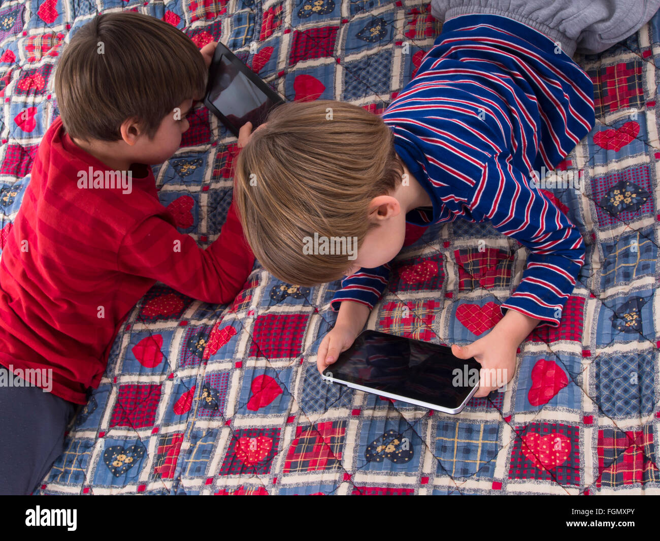 boys playing video games on tablet computers Stock Photo - Alamy