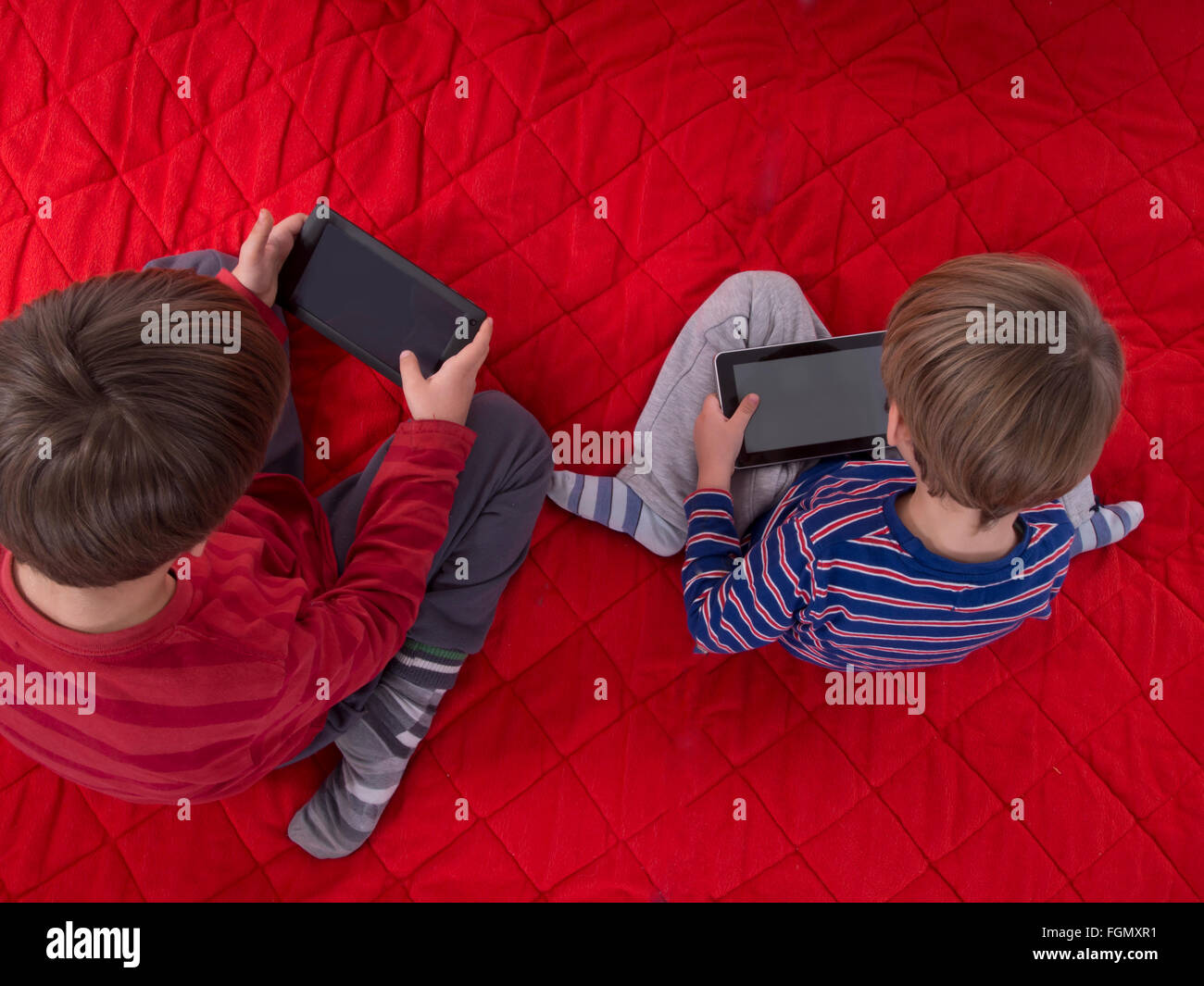 boys playing video games on tablet computers Stock Photo - Alamy