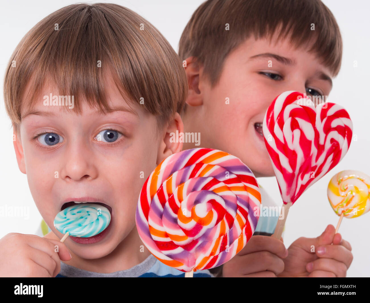 happy boys with lollipops Stock Photo - Alamy