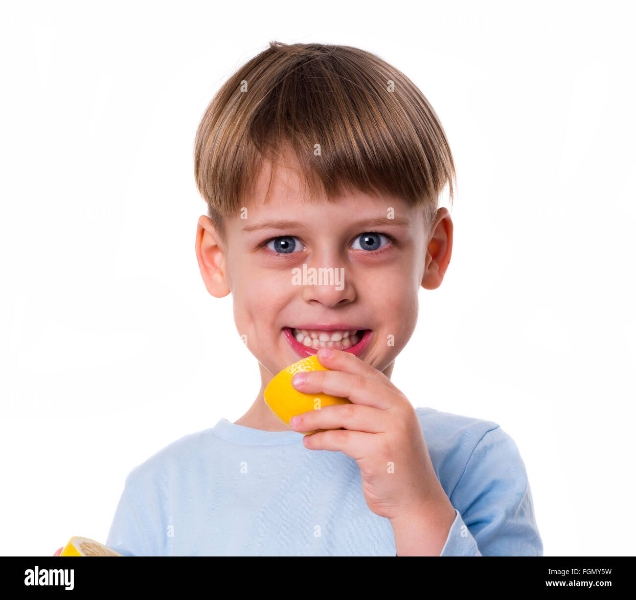boy eating lemon Stock Photo - Alamy